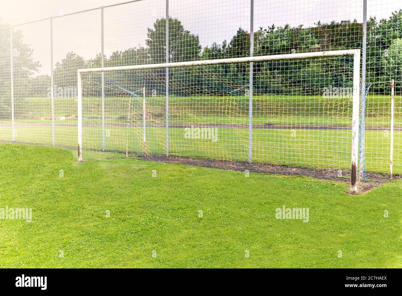 Empty football or soccer white gates. Soccer gate on green grassy field ...