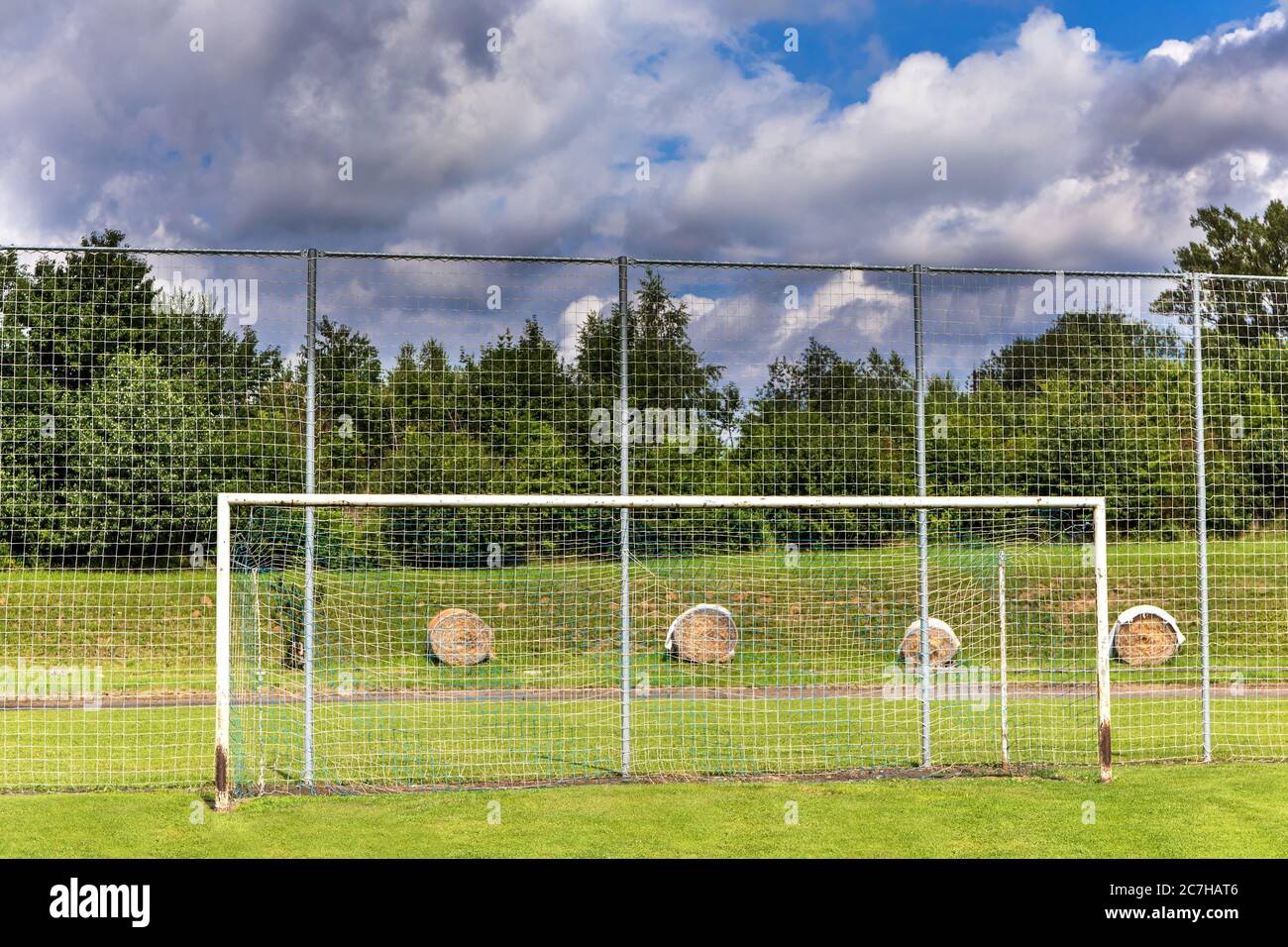 Empty football or soccer white gates. Soccer gate on green grassy field ...