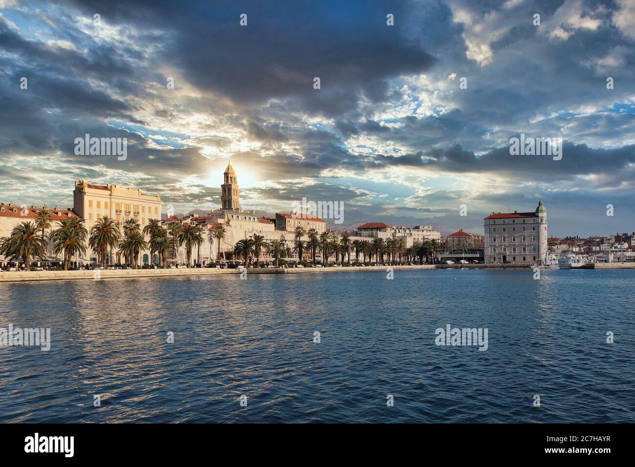 Seaside view of the town of Split, Croatia. Riviera with trees and the ...