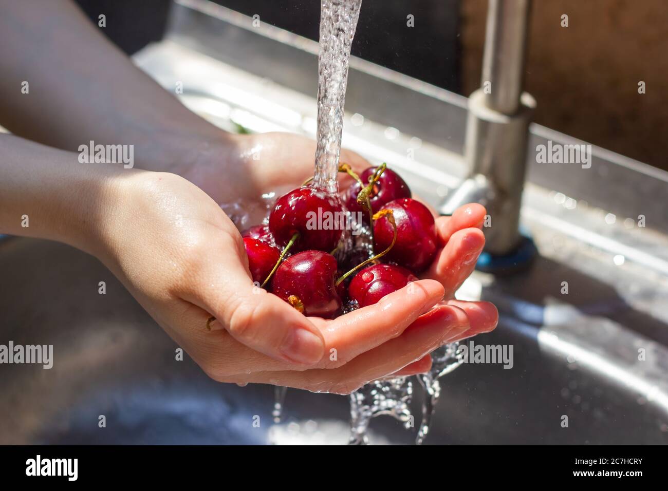 Washing sweet cherries hi-res stock photography and images - Alamy