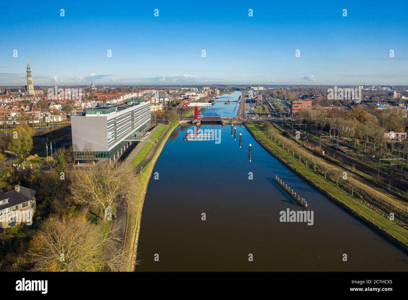 High angle shot of a lake in the middle of city buildings in Middelburg ...