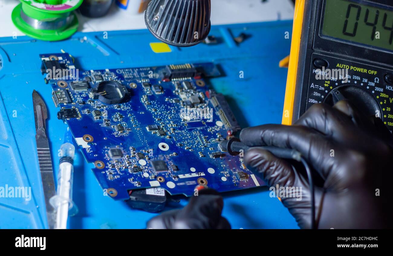 service worker repairing personal computer board Stock Photo - Alamy