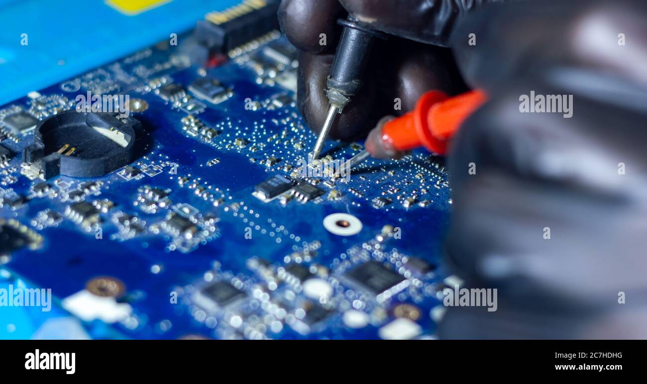 service worker repairing personal computer board Stock Photo - Alamy