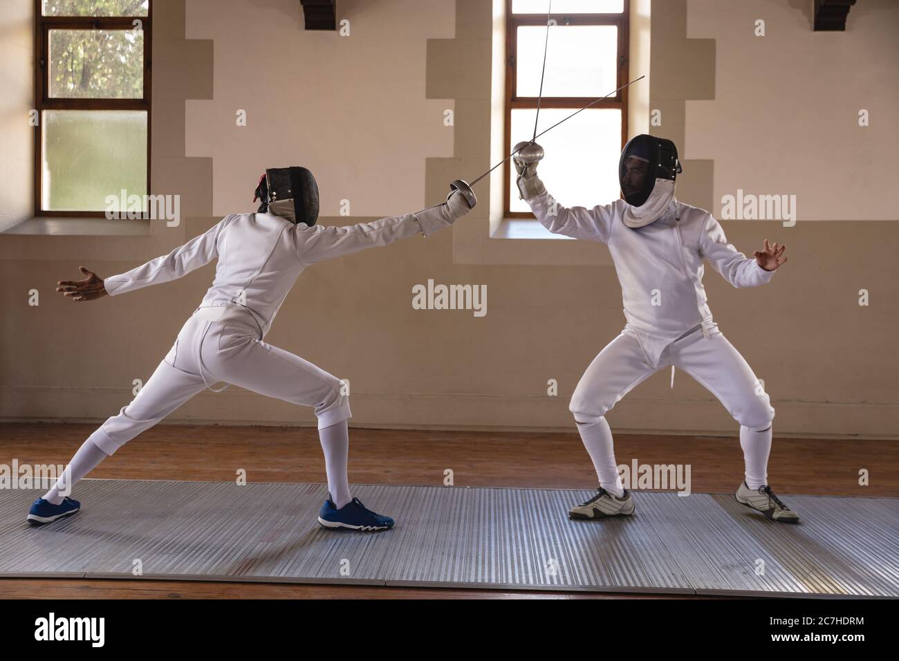 Two male fencers practicing fencing Stock Photo - Alamy
