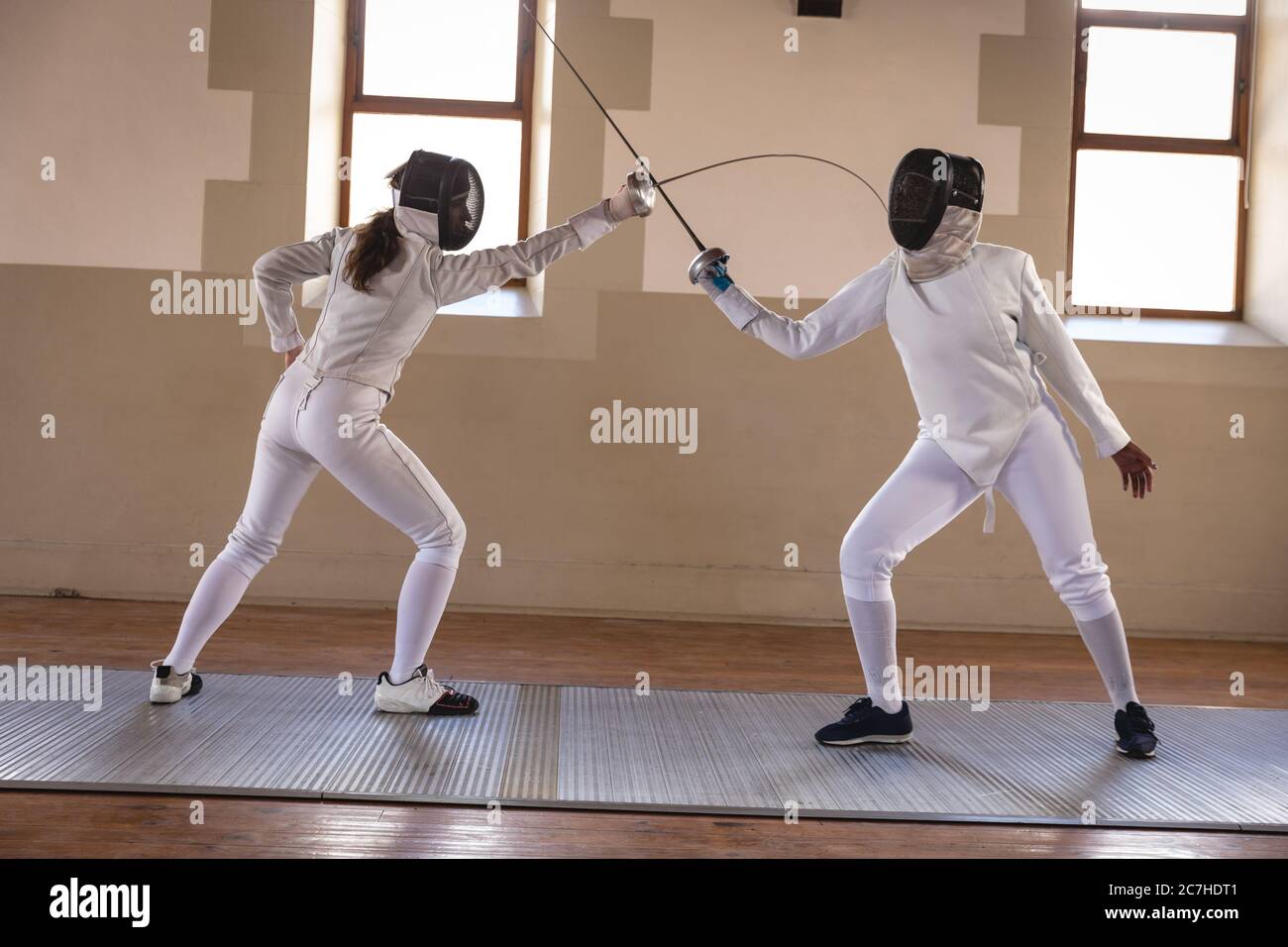 Two female fencers practicing fencing Stock Photo - Alamy