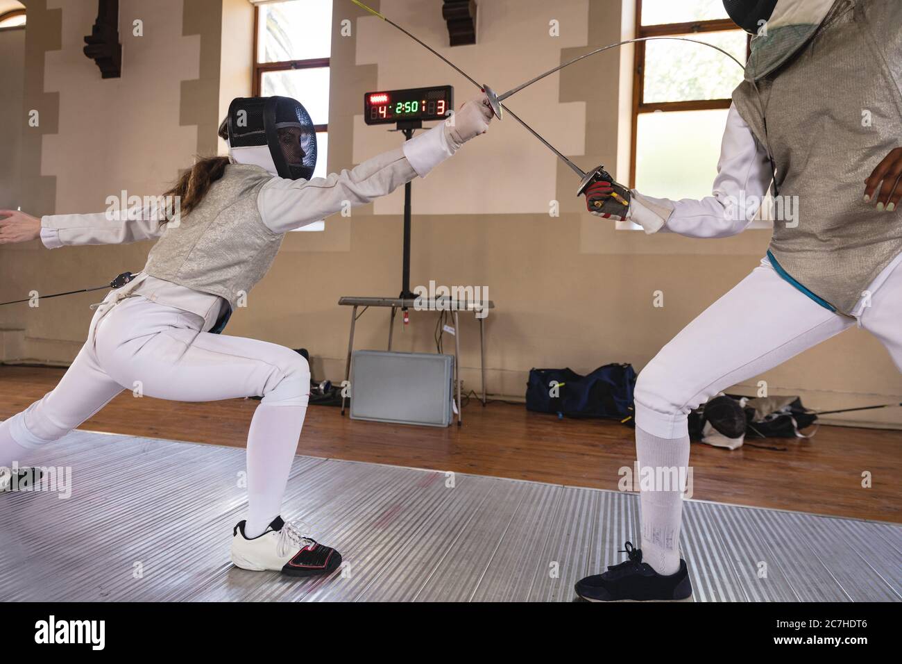 Two female fencers practicing fencing Stock Photo - Alamy