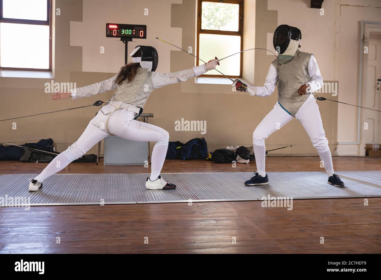 Two female fencers practicing fencing Stock Photo - Alamy