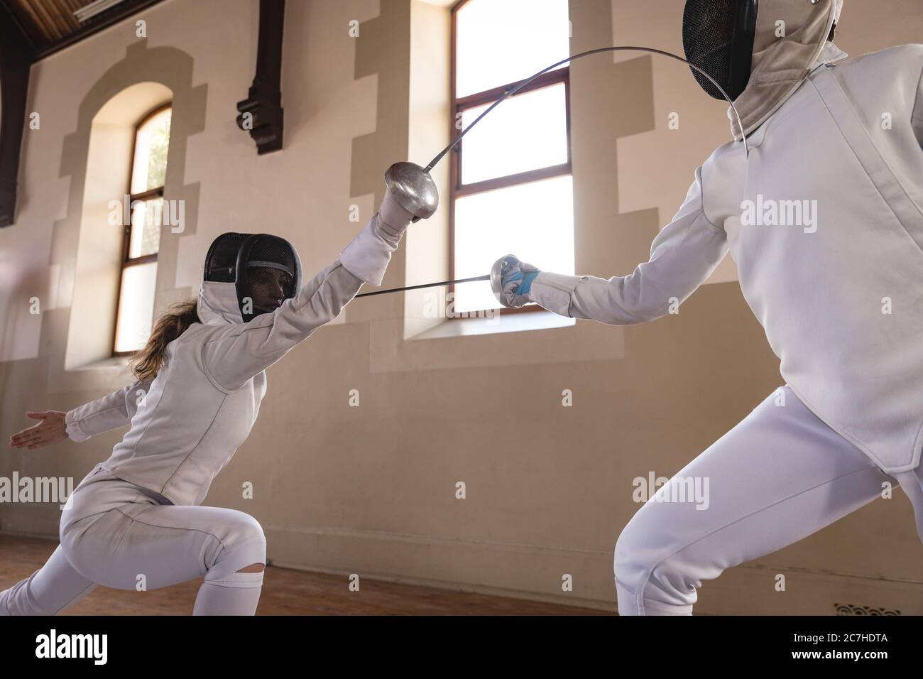 Two female fencers practicing fencing Stock Photo - Alamy