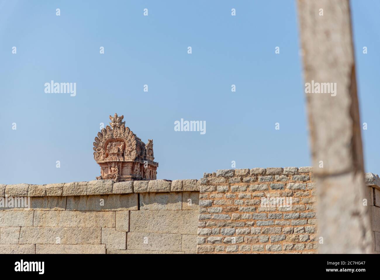 Wall with top of temple ruin in the background Stock Photo - Alamy