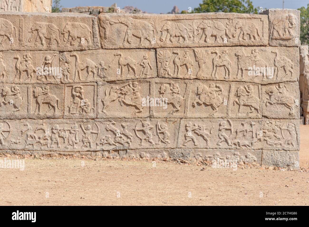 Indian temple wall with relief of hunting and riding scenes Stock Photo ...
