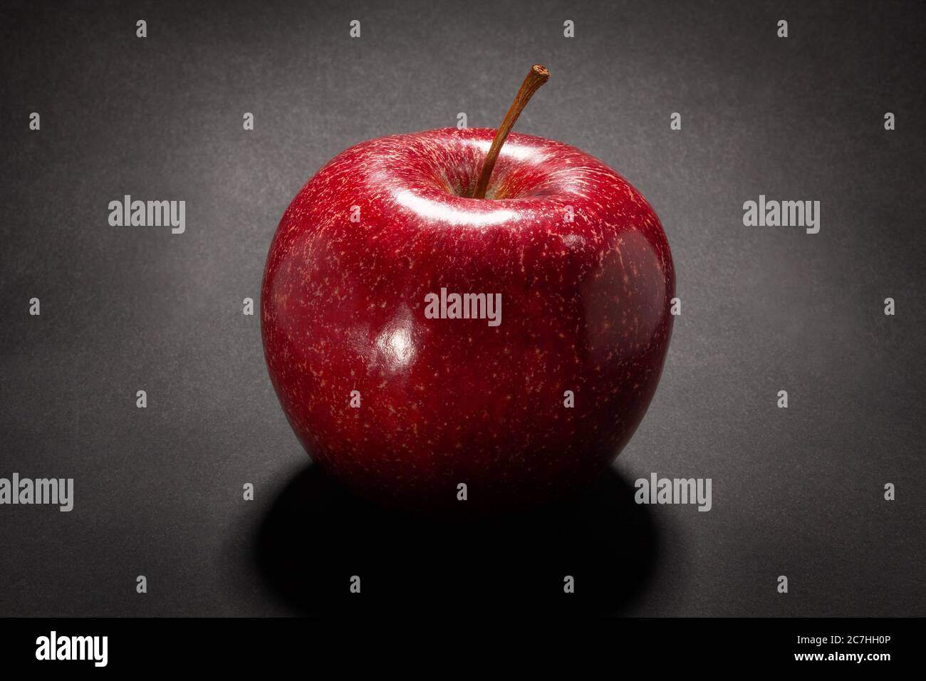 red apple on black background Stock Photo - Alamy