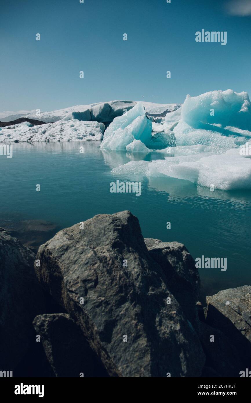 Vertical shot of the beautiful icebergs on the water captured in ...