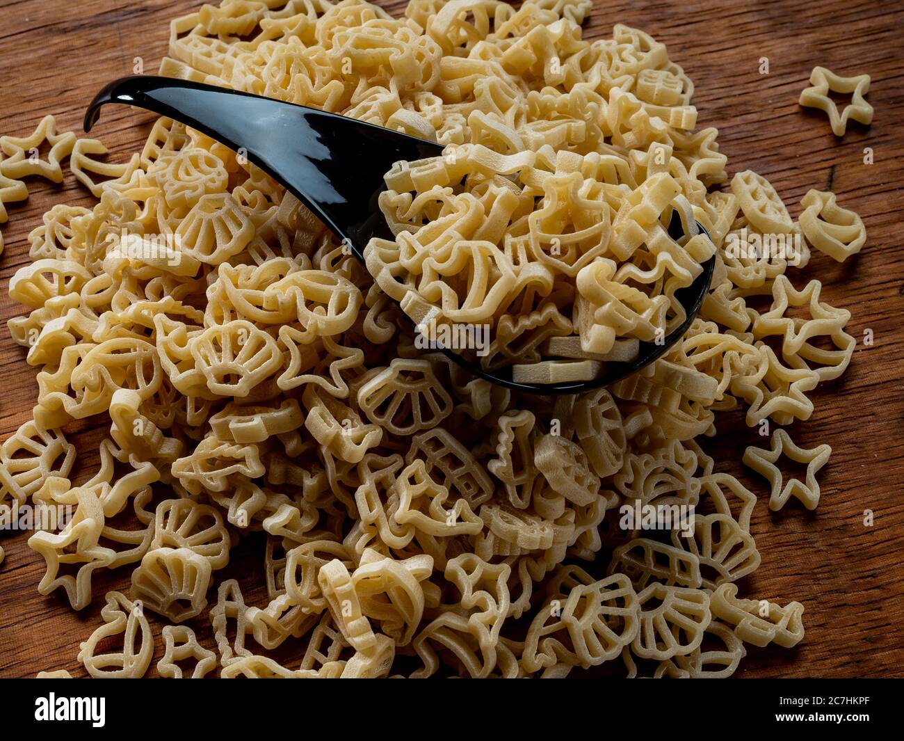 Durum wheat pasta with animal shapes for soup Stock Photo - Alamy