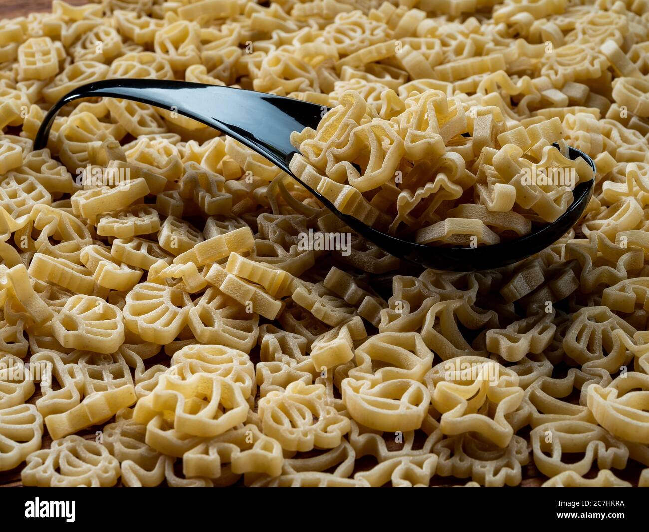 Durum wheat pasta with animal shapes for soup Stock Photo - Alamy