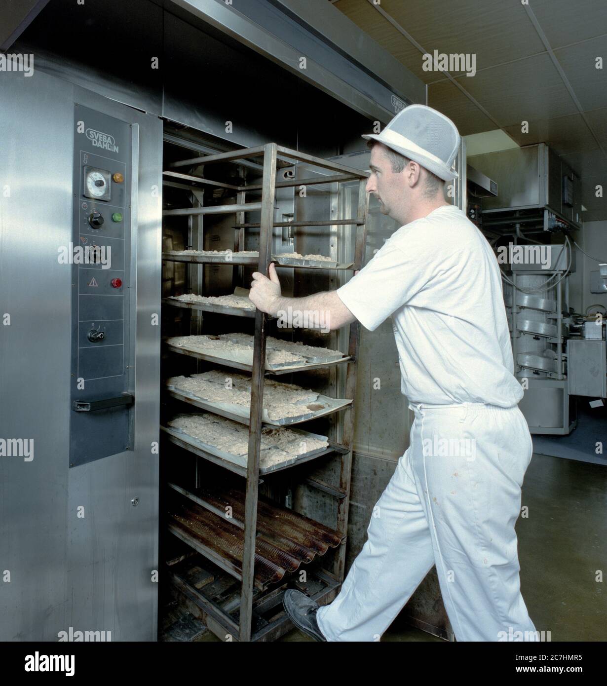 Baker Loading Oven Stock Photo - Alamy
