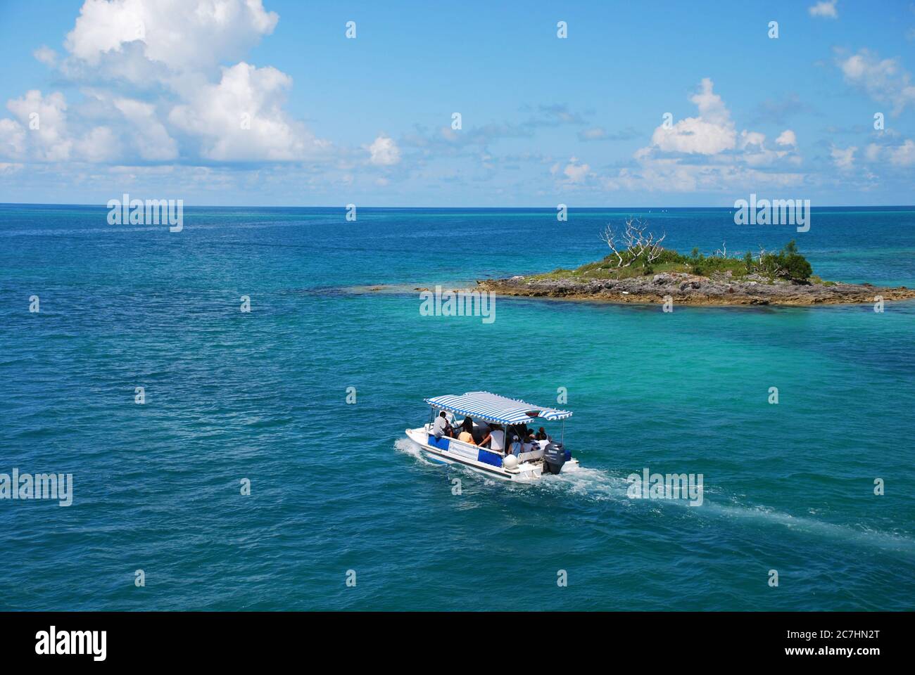 A tourist boat heads around the island of Beautiful Bermuda Stock Photo ...