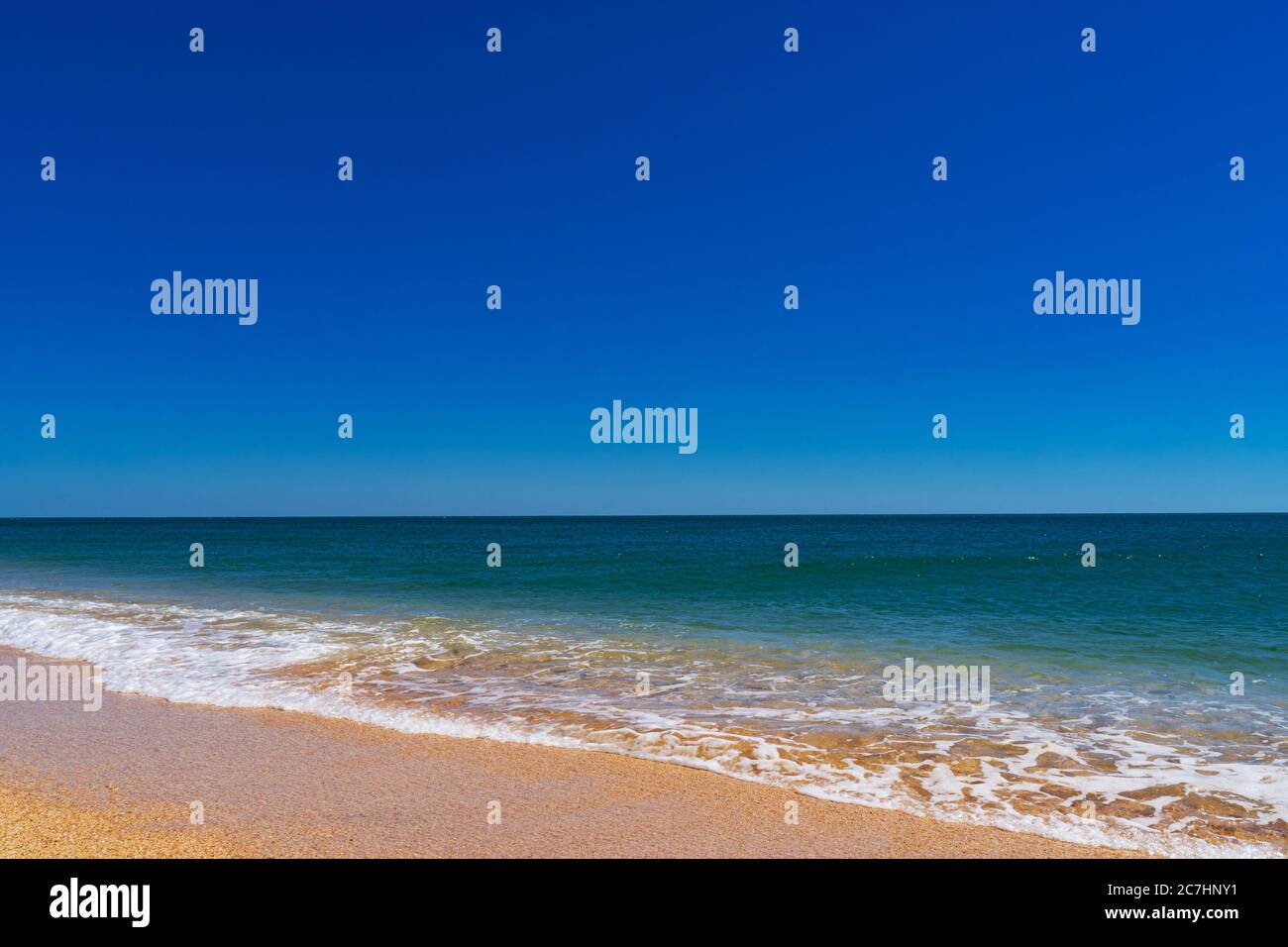 the azure turquoise sea with yellow sand from shells Stock Photo - Alamy