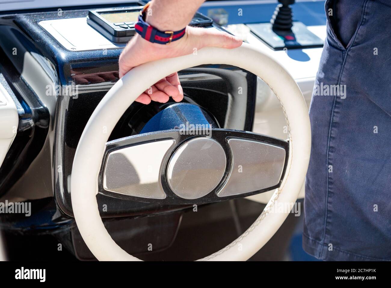 Caucasian male driving boat hi-res stock photography and images - Alamy