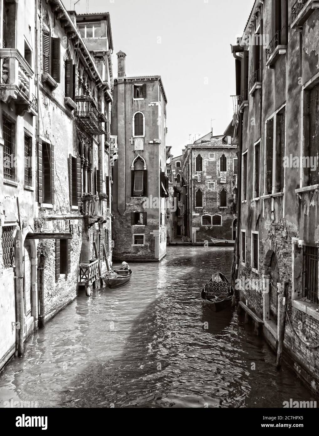 Vertical high angle greyscale shot of a Canal in the Historic District ...