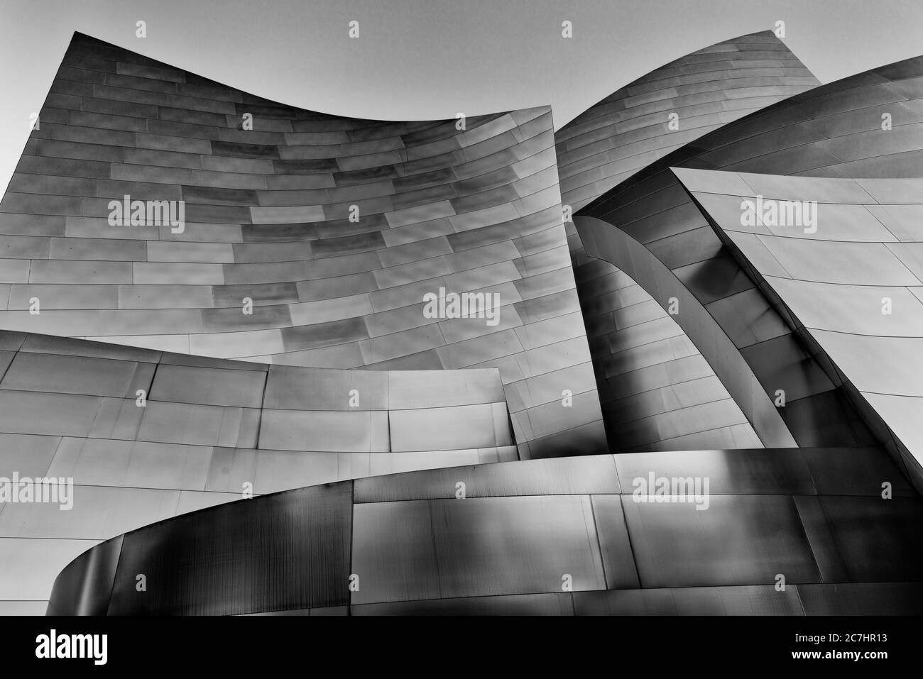 Greyscale shot of the facade of a modern building with dark grey walls ...