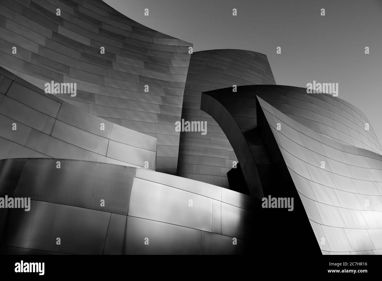 Greyscale shot of the facade of a modern building with dark grey walls ...