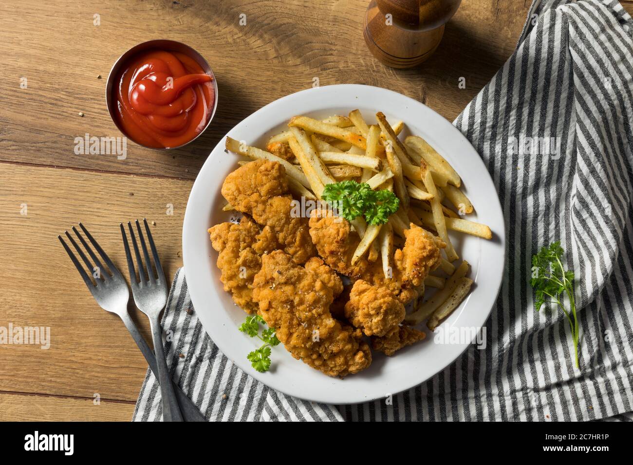 Deep Fried Chicken Tenders and Fries with Sauce Stock Photo - Alamy