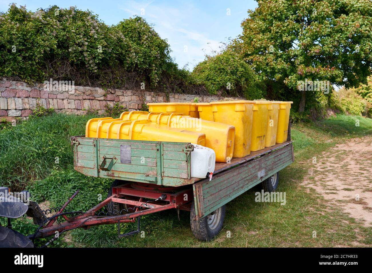 Vintage, two-axle trailer with full and empty reading containers in ...