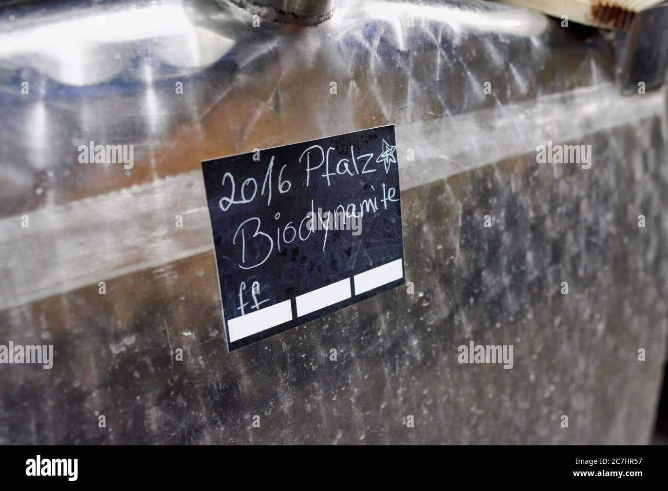 black tank label on stainless steel wine tank with chalk lettering ...
