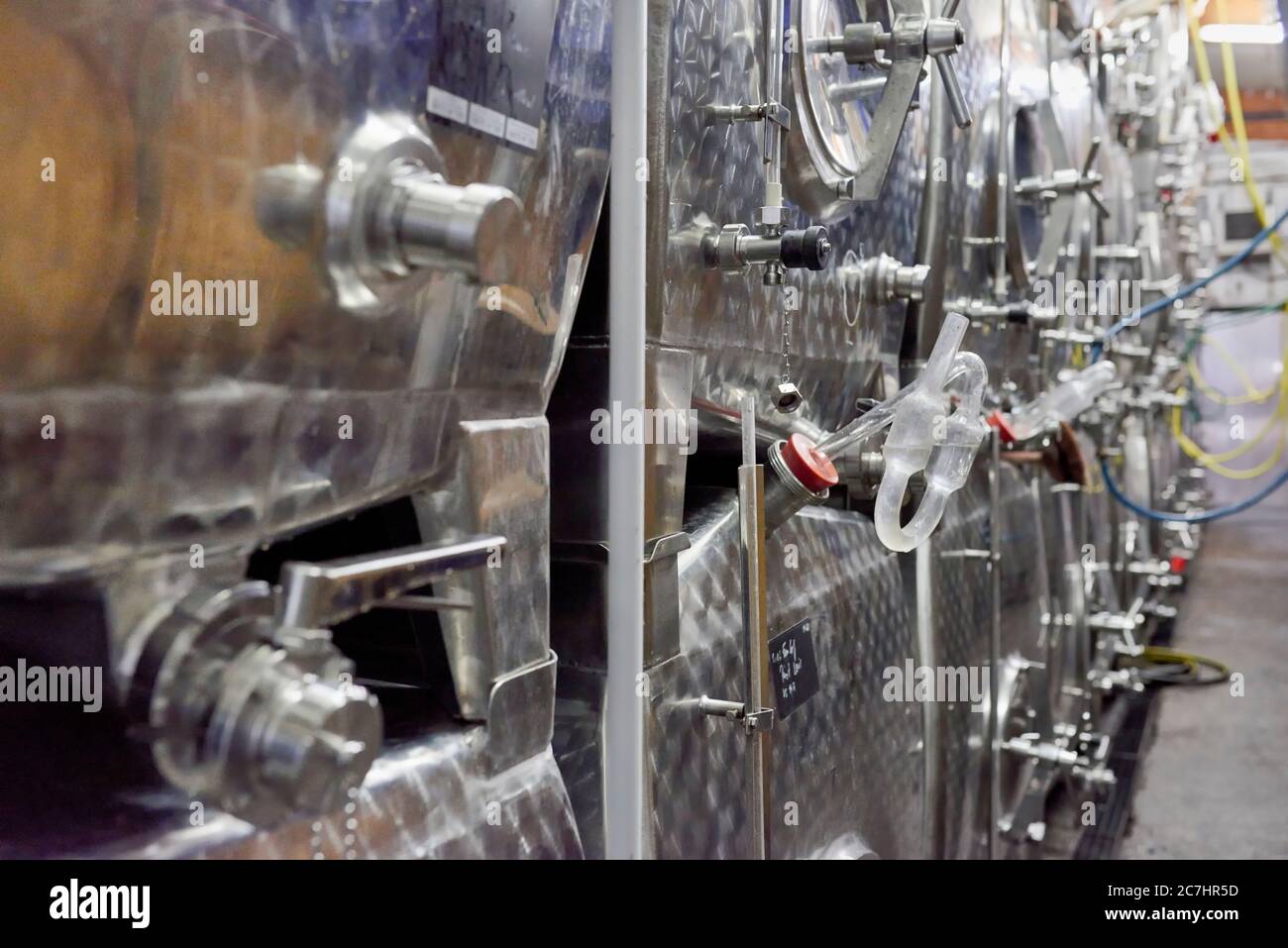 Stainless steel mash tanks in the fermentation cellar with fermentation ...