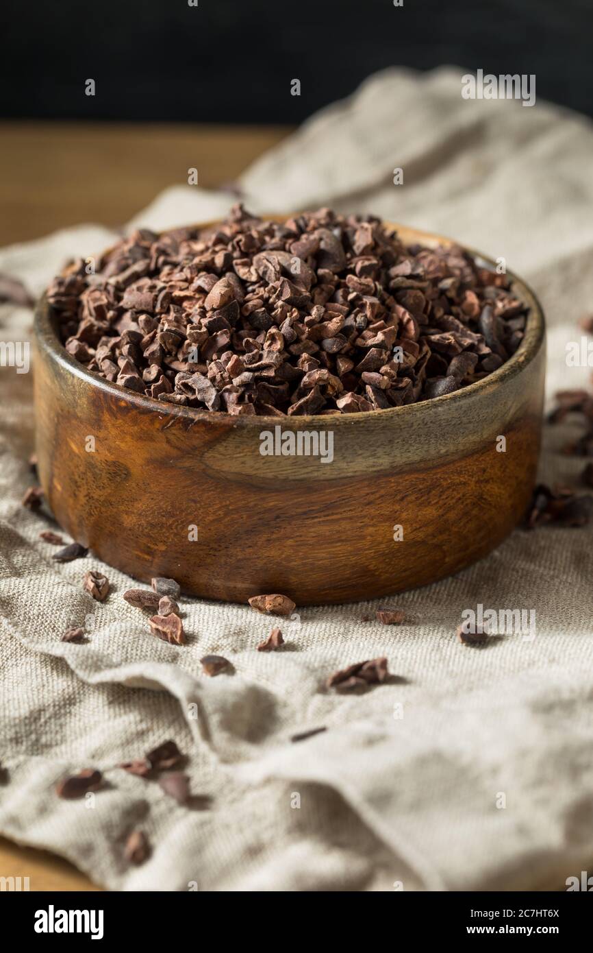 Raw Brown Organic Chocolate Cocao Nibs in a Bowl Stock Photo - Alamy