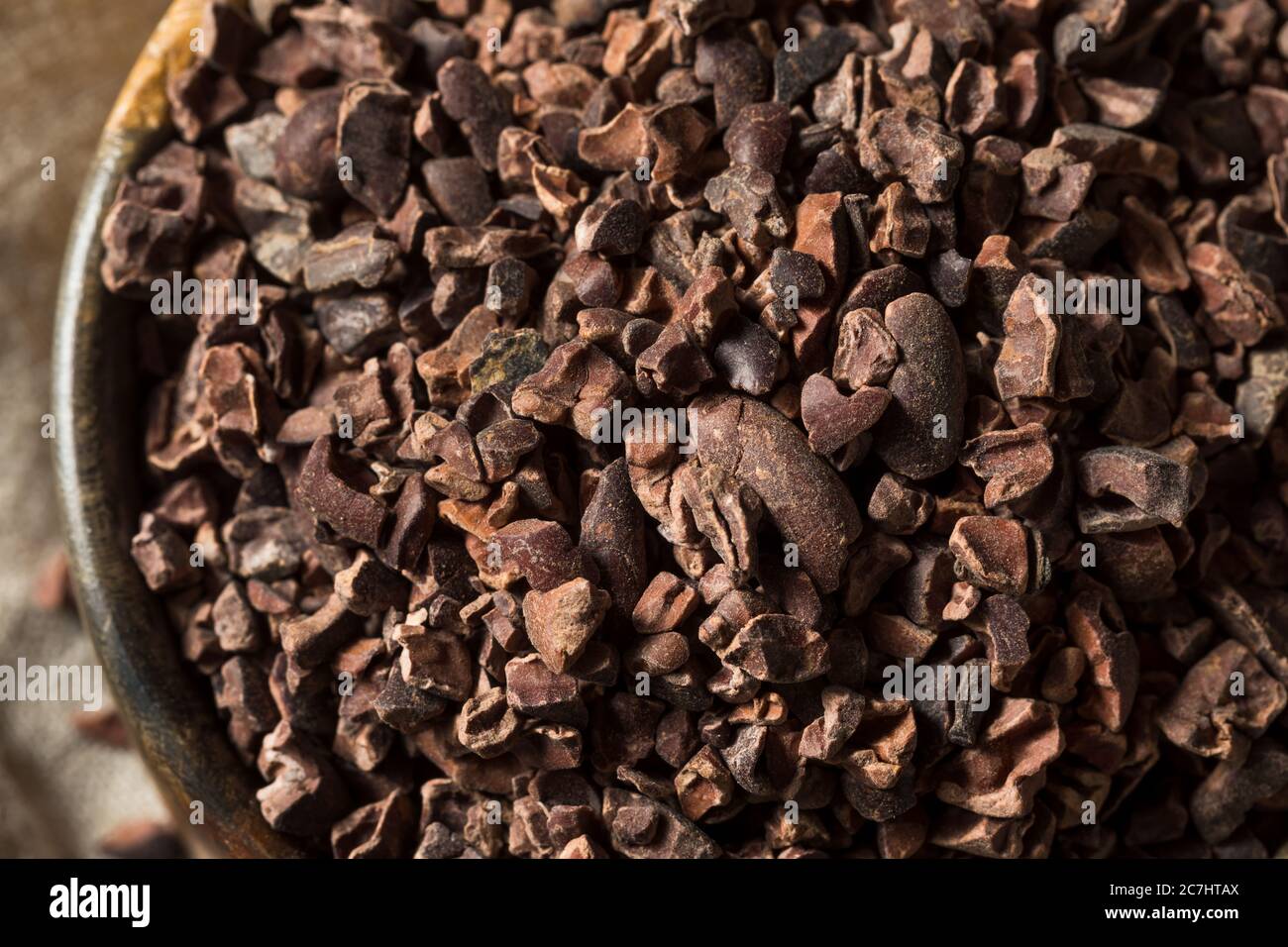 Raw Brown Organic Chocolate Cocao Nibs in a Bowl Stock Photo - Alamy