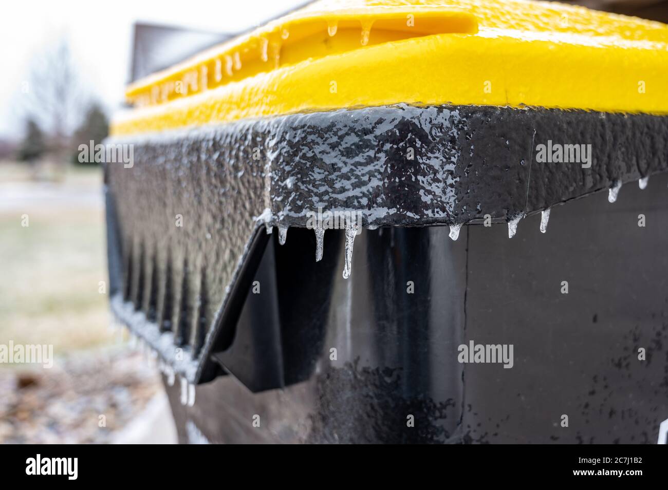 close focus on trash bin edge for incremental weather and municipal ...