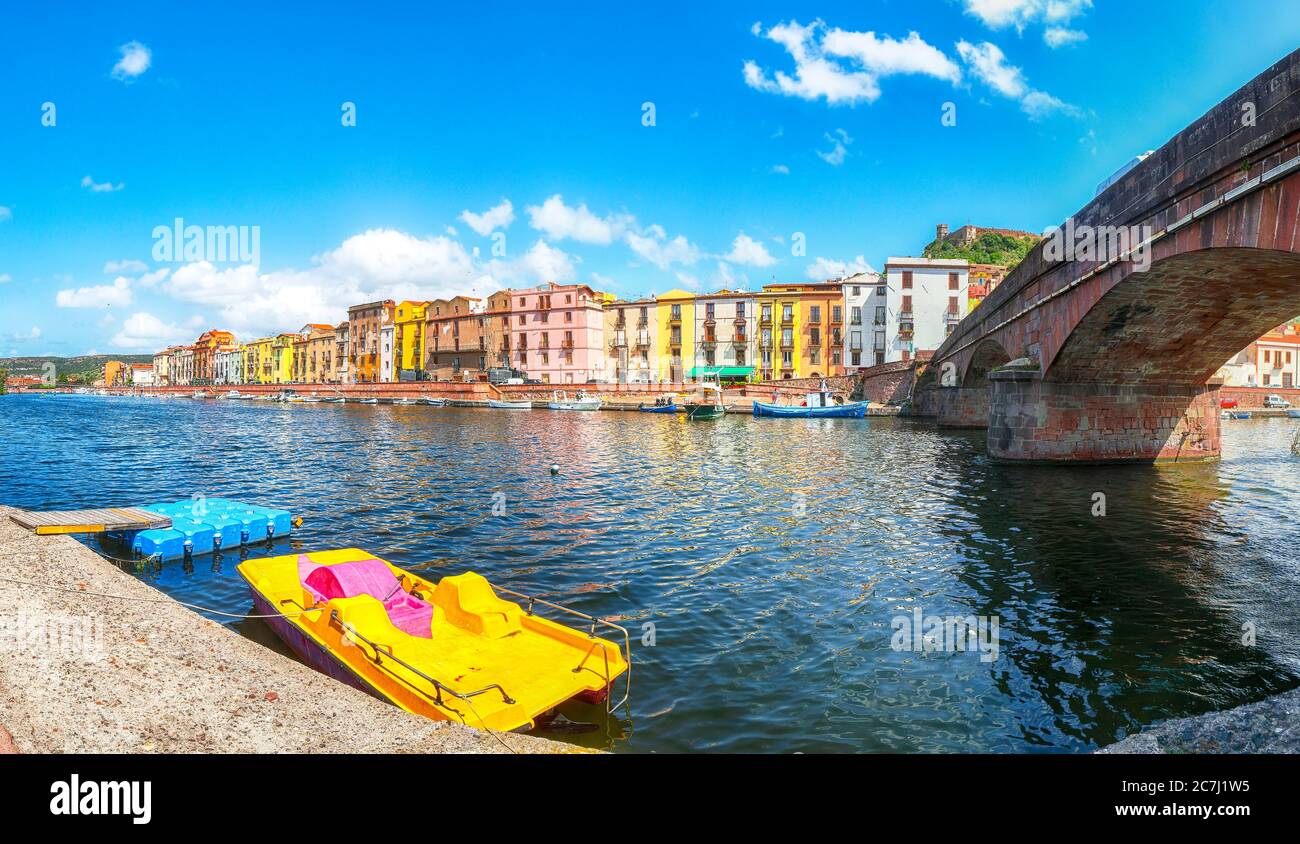 Astonishing cityscape of Bosa town with Ponte Vecchio bridge across the ...