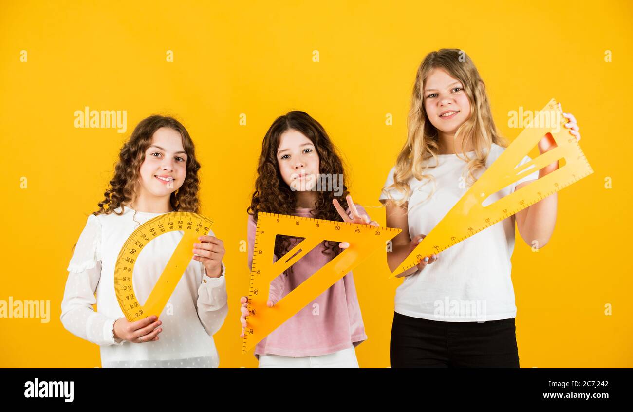 Smart and confident. exact sciences. three girls with protractor and ...