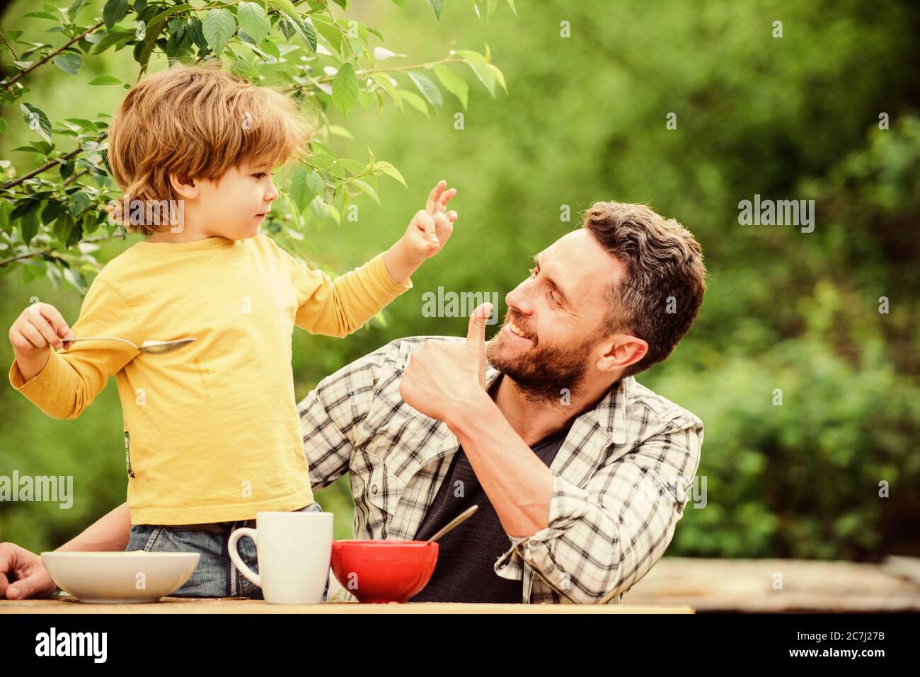 Father son eat food and have fun. Menu for children. Homemade meal ...