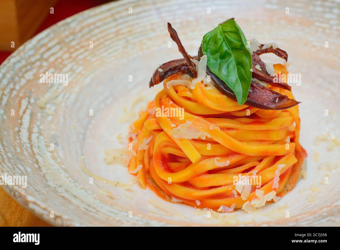 Spaghetti in a plate with a leaf of basil, horizontal format Stock ...