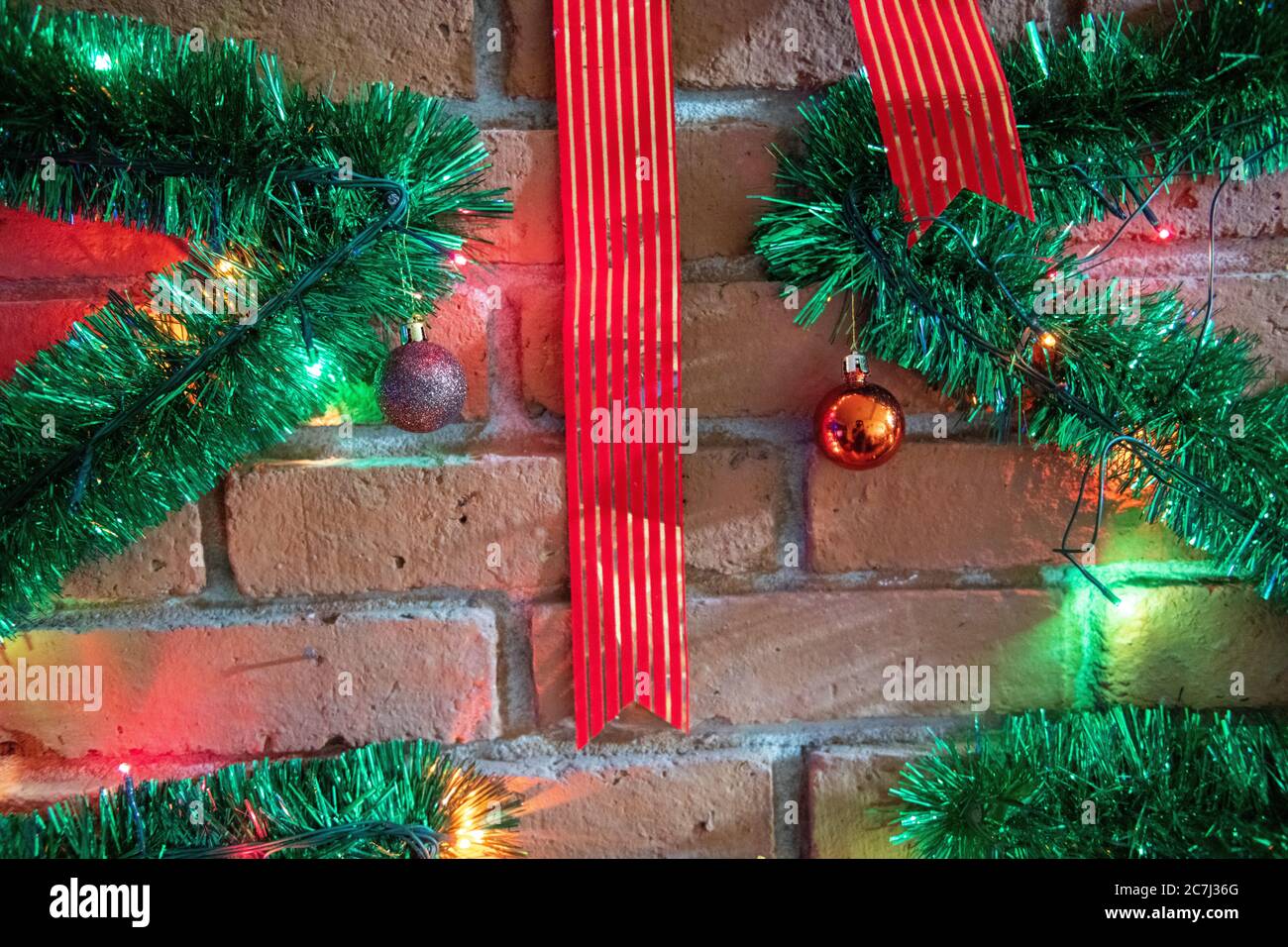 Red ribbon on the bricks of a chimney during Christmas holidays Stock ...