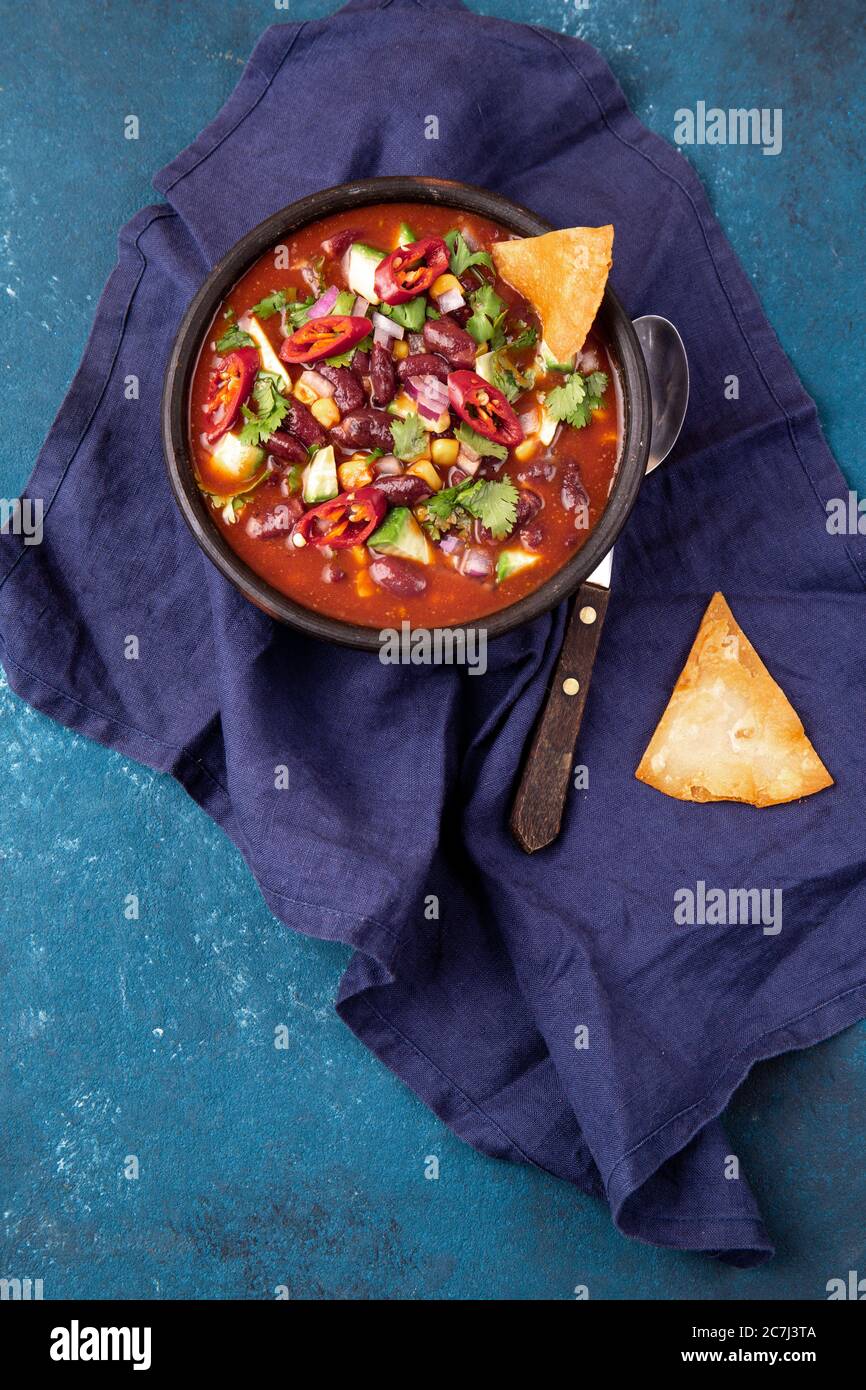 Mexican chile bean soup on blue background Stock Photo - Alamy