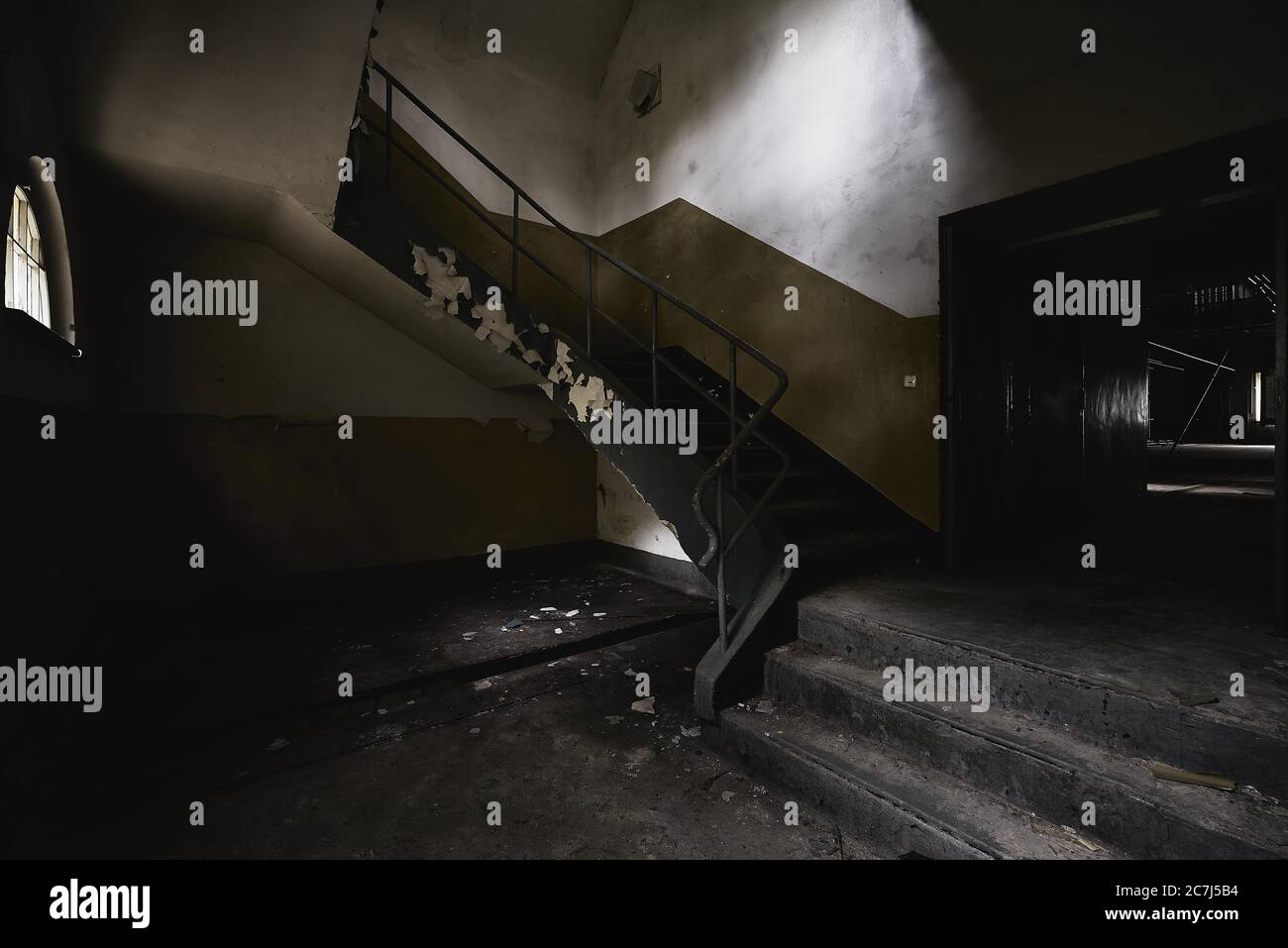 Rusty staircase inside a dark old abandoned building Stock Photo - Alamy