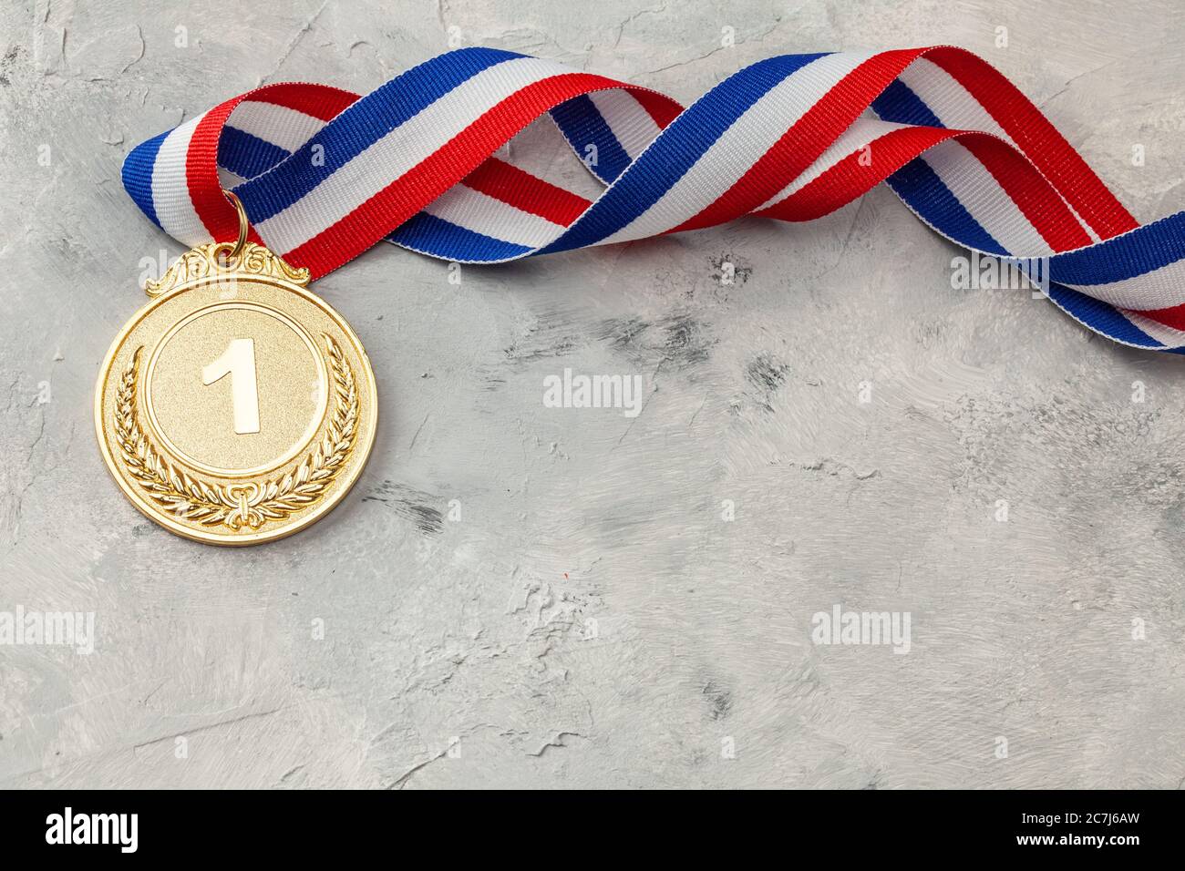 Gold medal. First place award with ribbon Stock Photo - Alamy