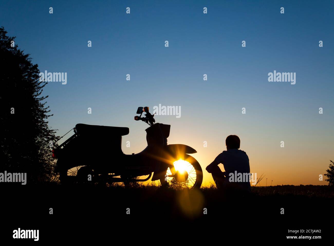 Silhouette, moped, person Stock Photo - Alamy