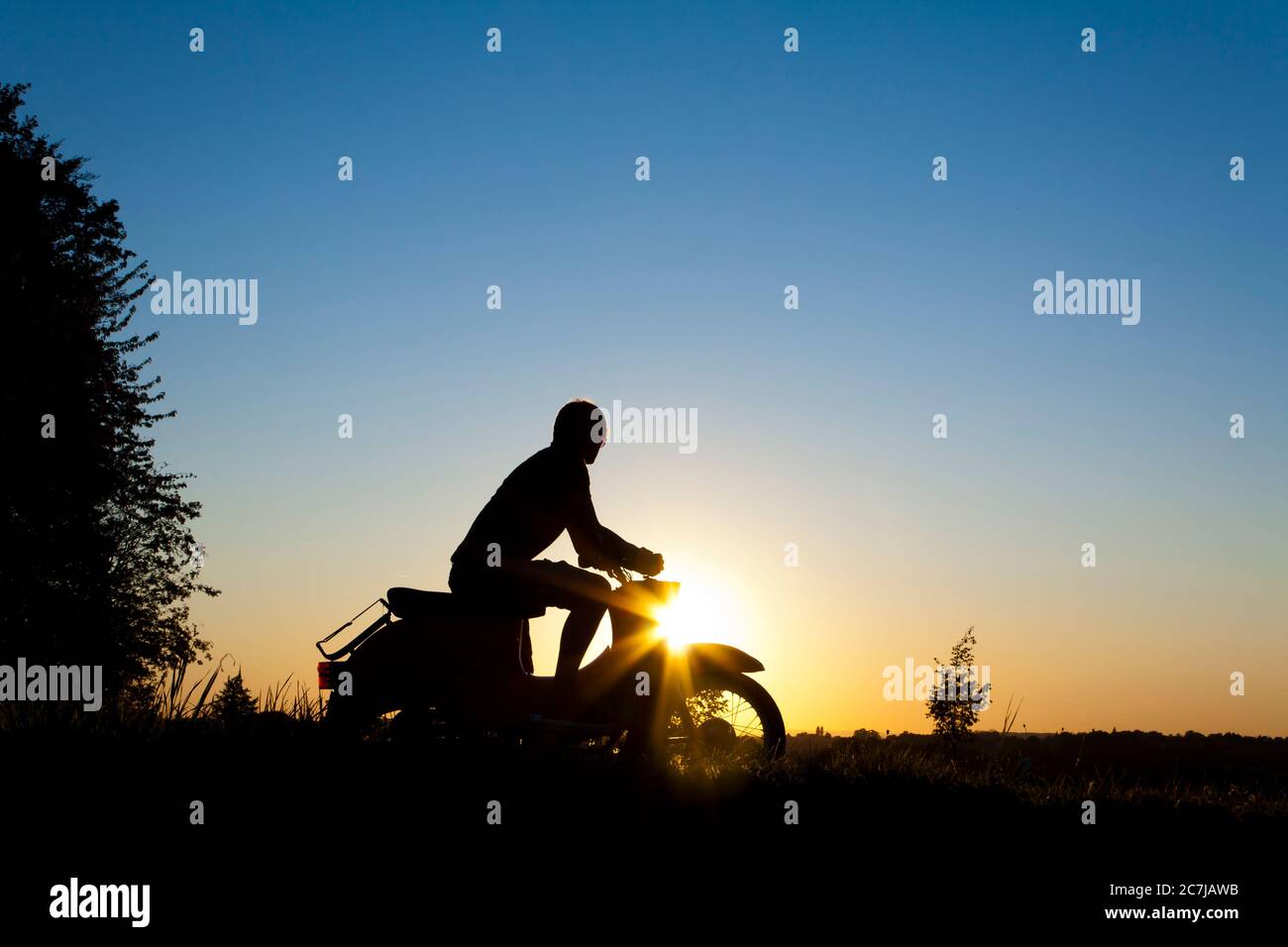 Silhouette, moped, person Stock Photo - Alamy