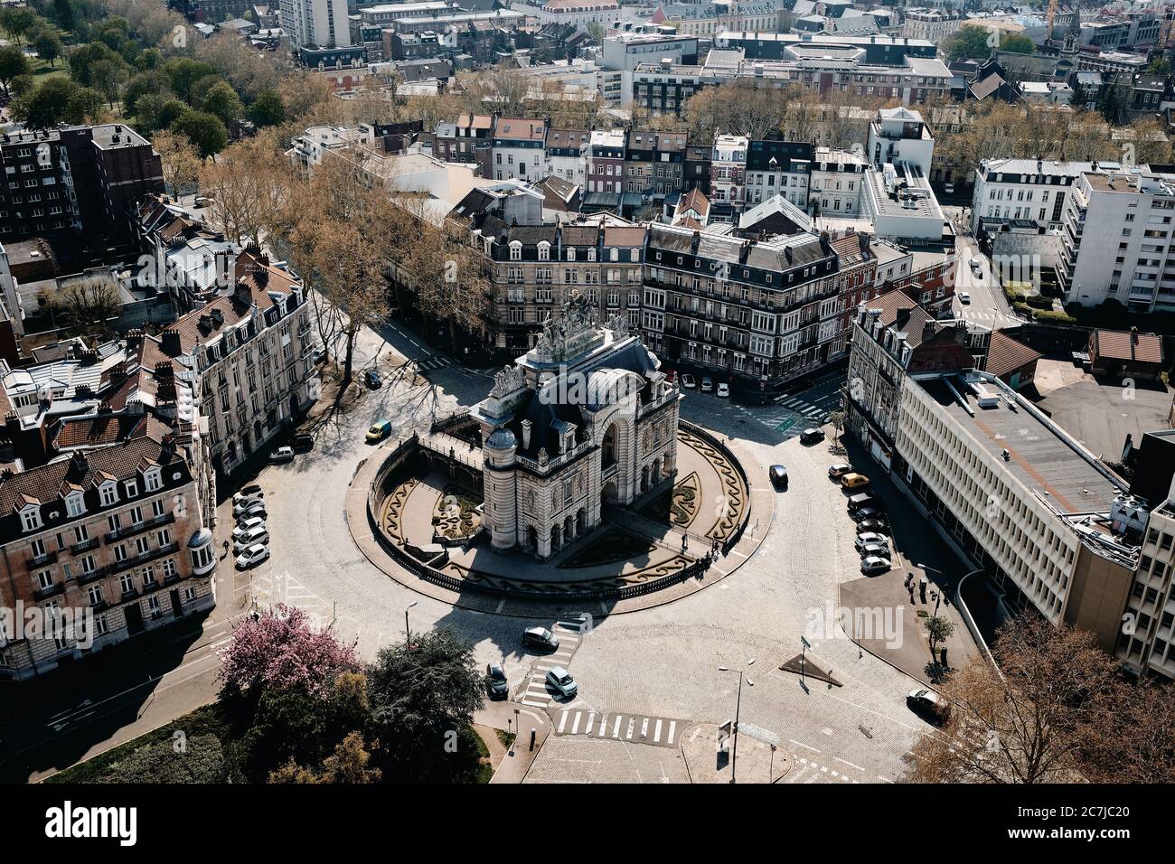 Aerial shot of a cityscape with a lot of cars and beautiful buildings ...
