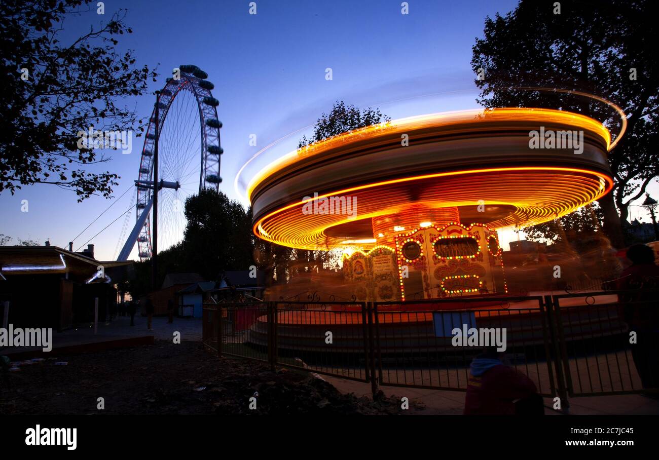 LONDON, UNITED KINGDOM - Nov 11, 2012: Roundabout spinning in front of ...