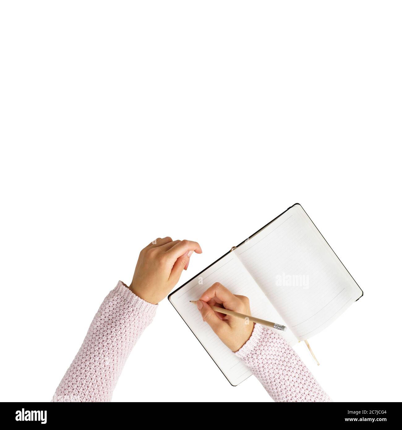 Hands write with a pen in the diary on a white background. Isolated ...
