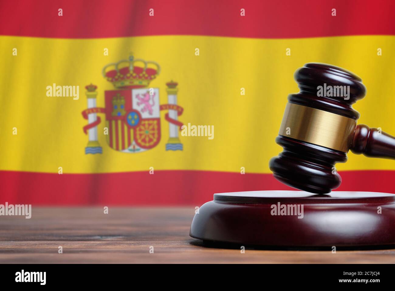 Justice and court concept in Kingdom of Spain. Judge hammer on a flag ...