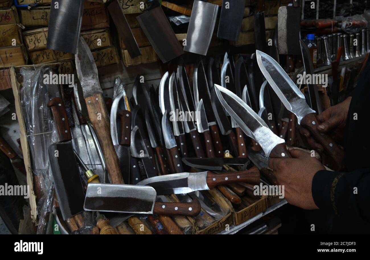 Lahore, Pakistan. 17th July, 2020. Pakistani blacksmiths sharpens meat ...