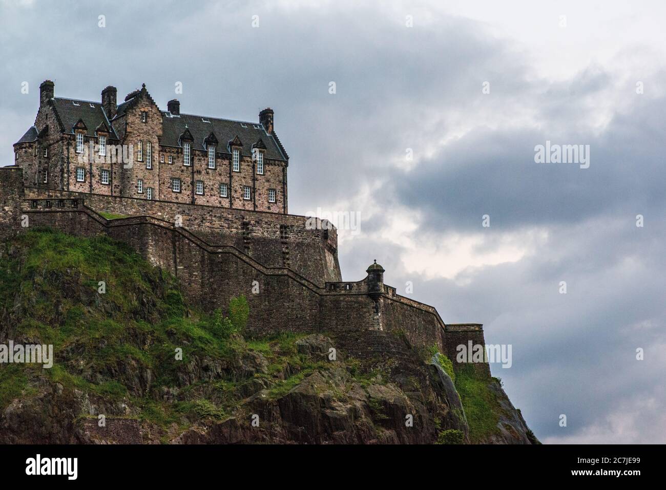 Edinburgh Castle sitting atop Castle Rock in Edinburgh, Scotland is an ...