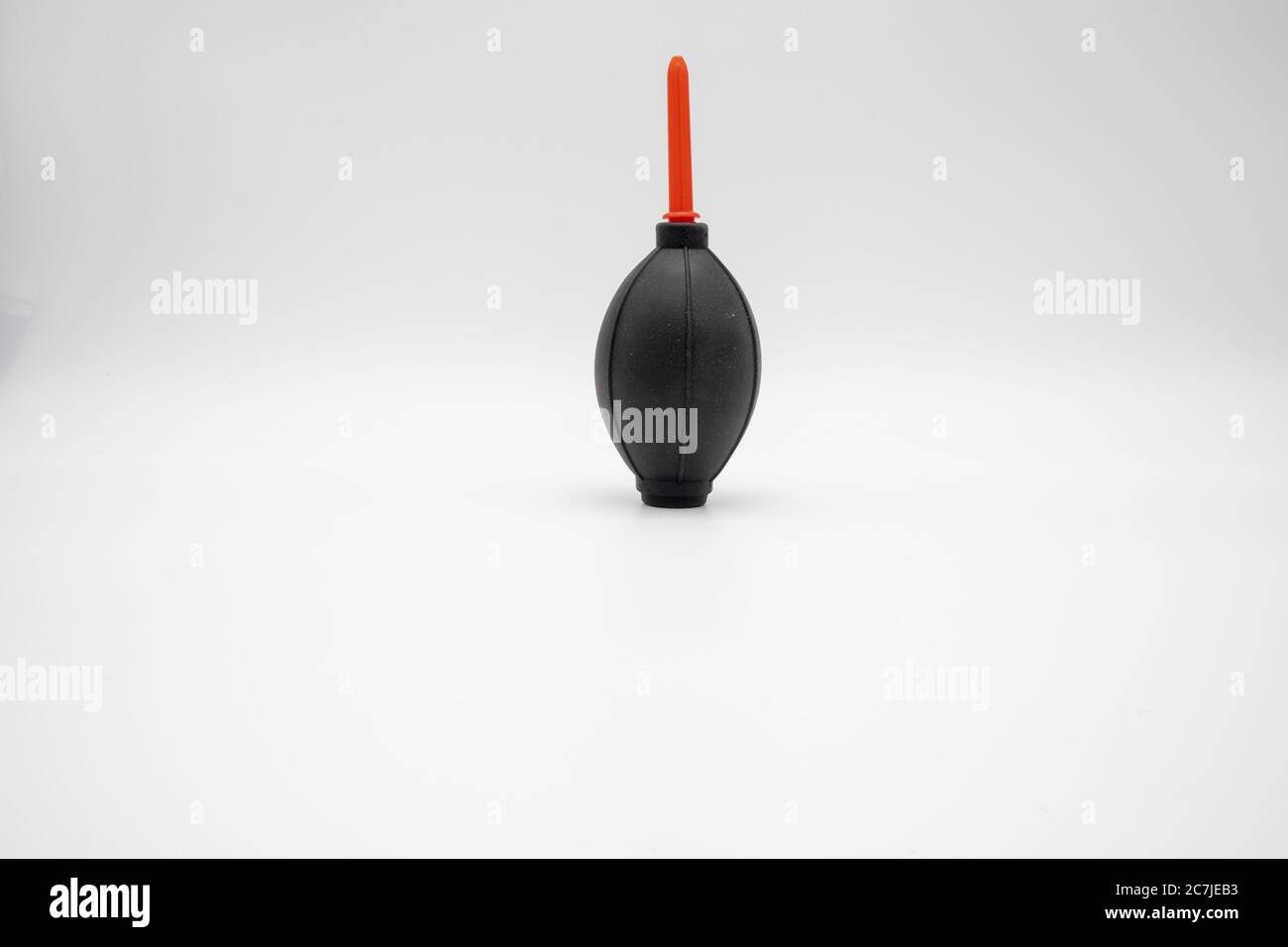 Black clyster with an orange straw against a white background Stock ...