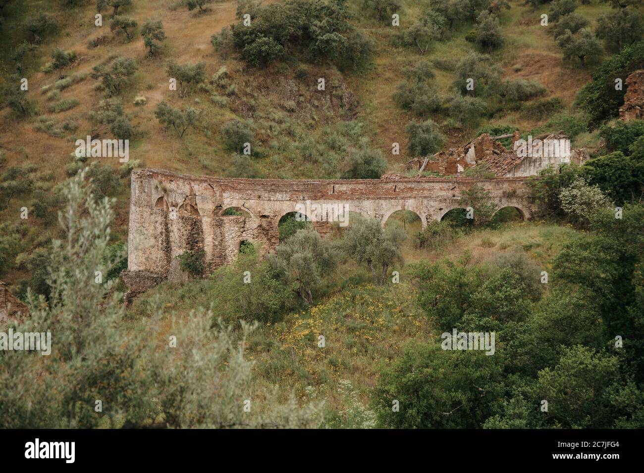 Green landscape with high mountains and destroyed building ruins Stock ...